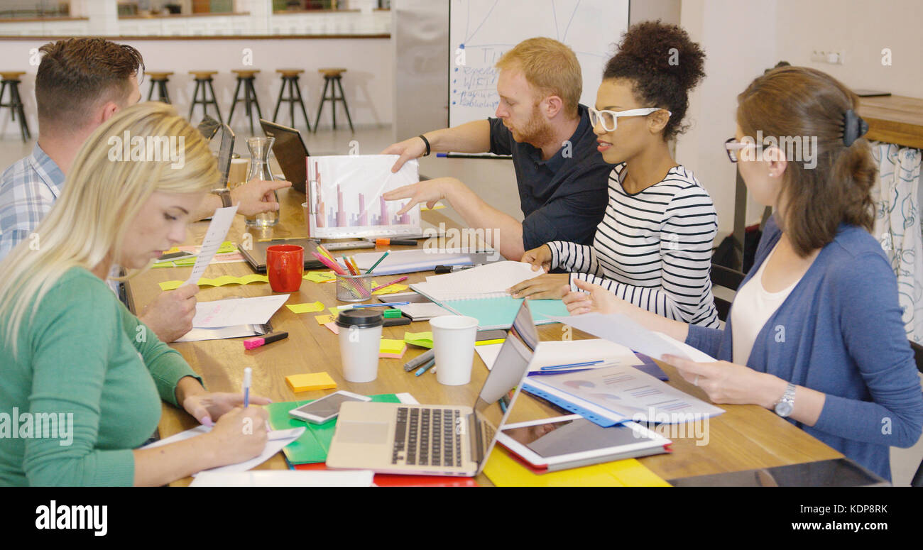 Group of people working at desktop Stock Photo - Alamy