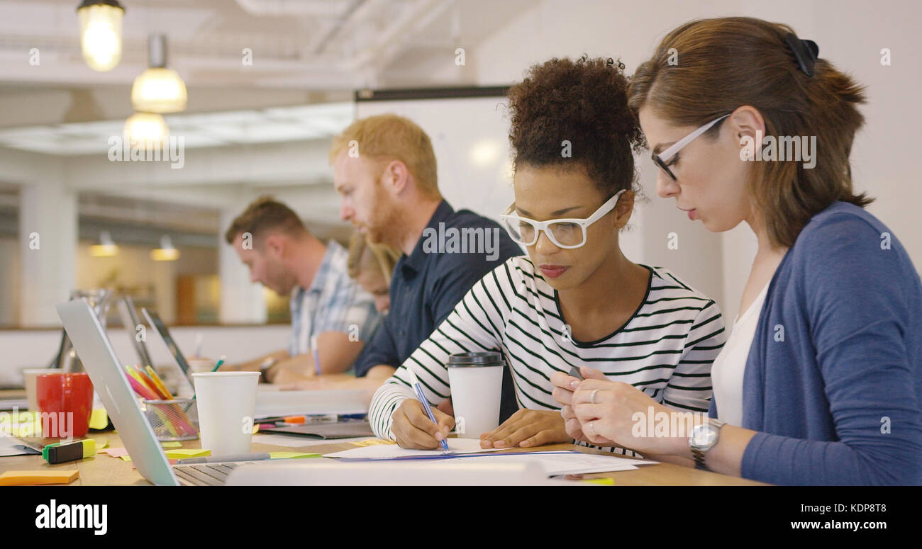 Busy people in contemporary office Stock Photo - Alamy