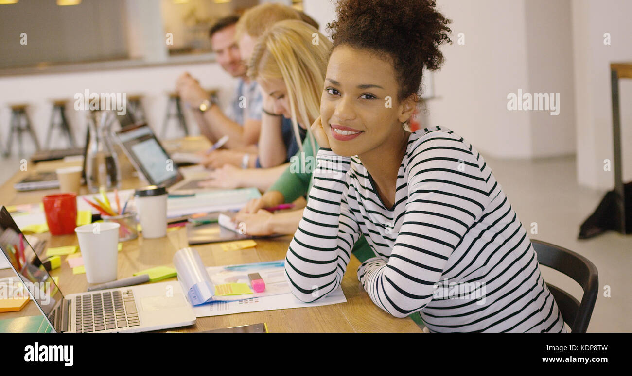 Beautiful worker posing at camera Stock Photo - Alamy
