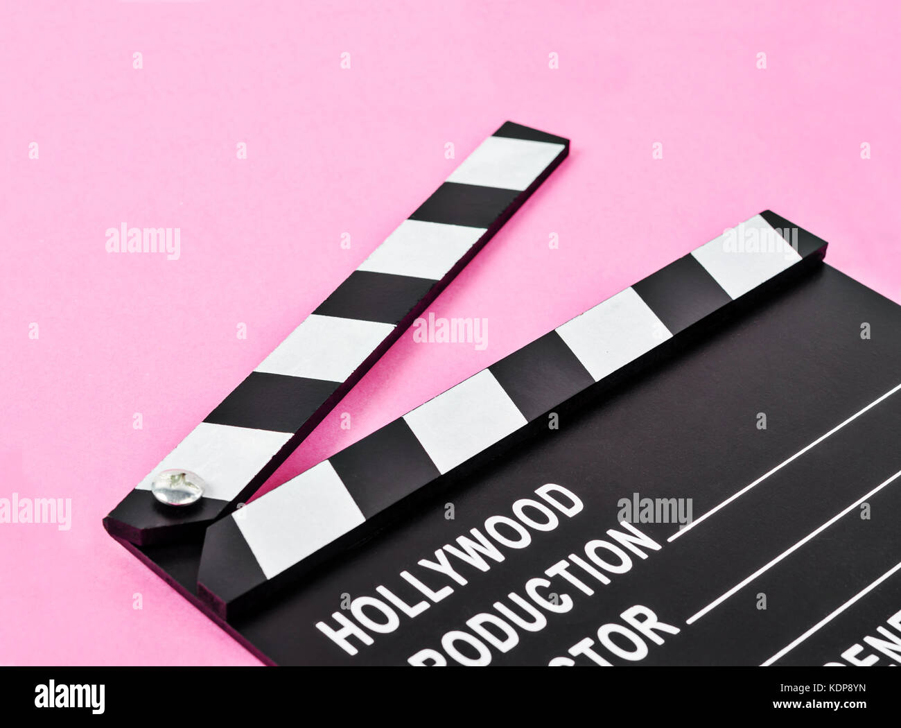 Blank movie production clapper board or slate film over pink background ...