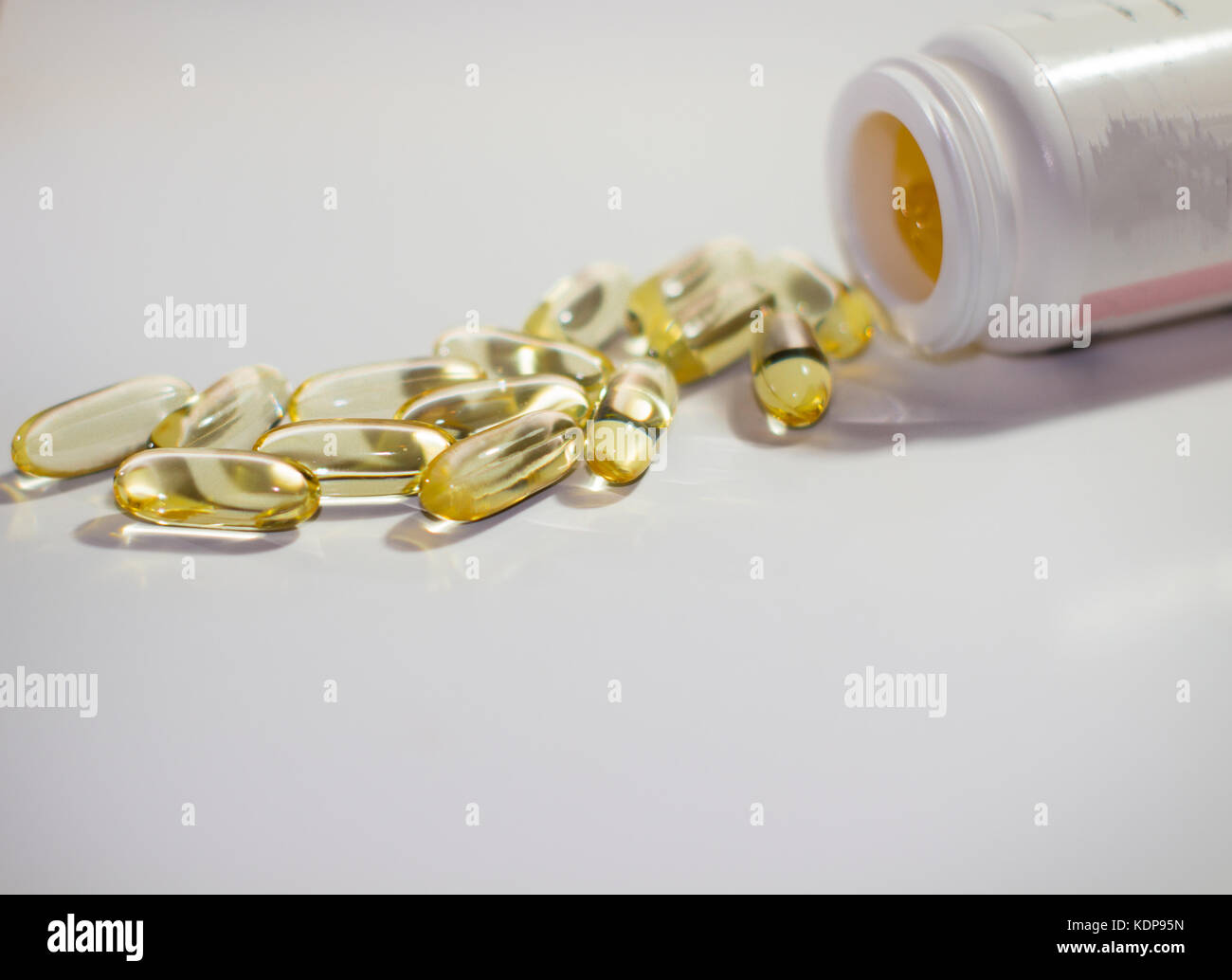 medication fish oil for heart health pills on a with background Stock ...