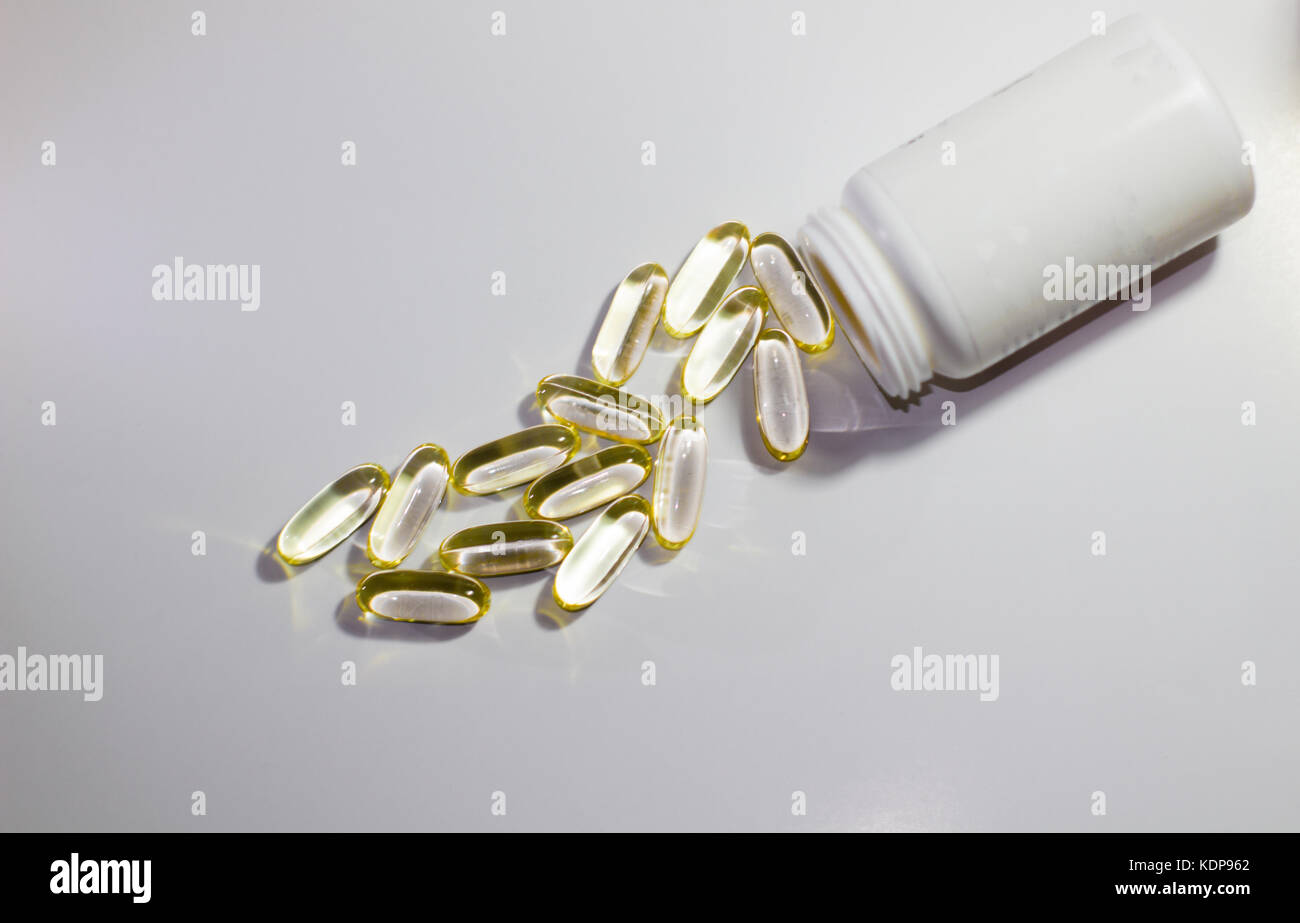 medication fish oil for heart health pills on a with background Stock ...