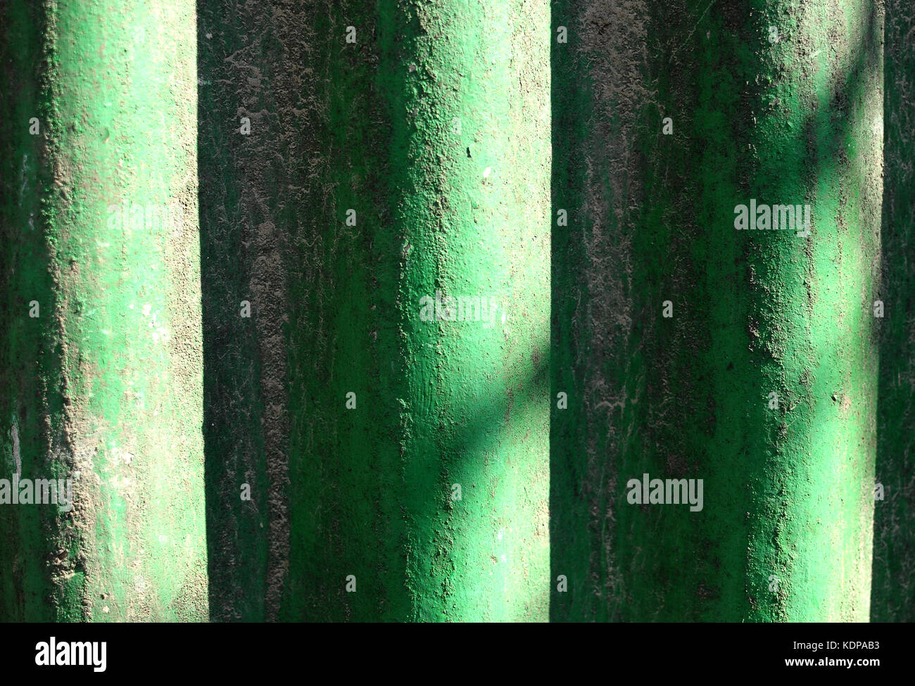 Sunlit green painted wavy slate background. Shabby wavy slate texture ...