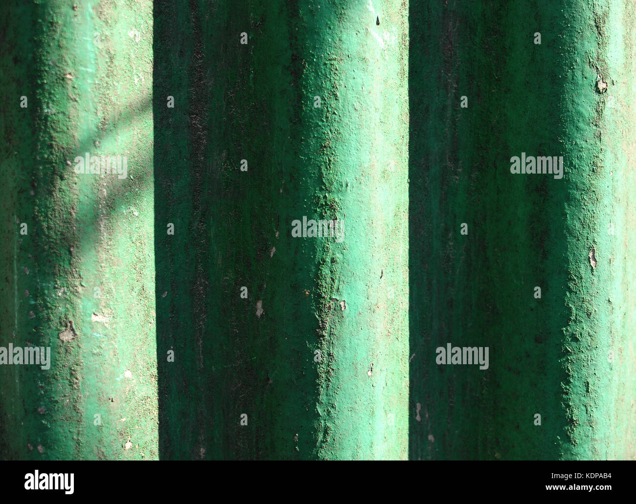 Sunlit green painted wavy slate background. Shabby wavy slate texture ...