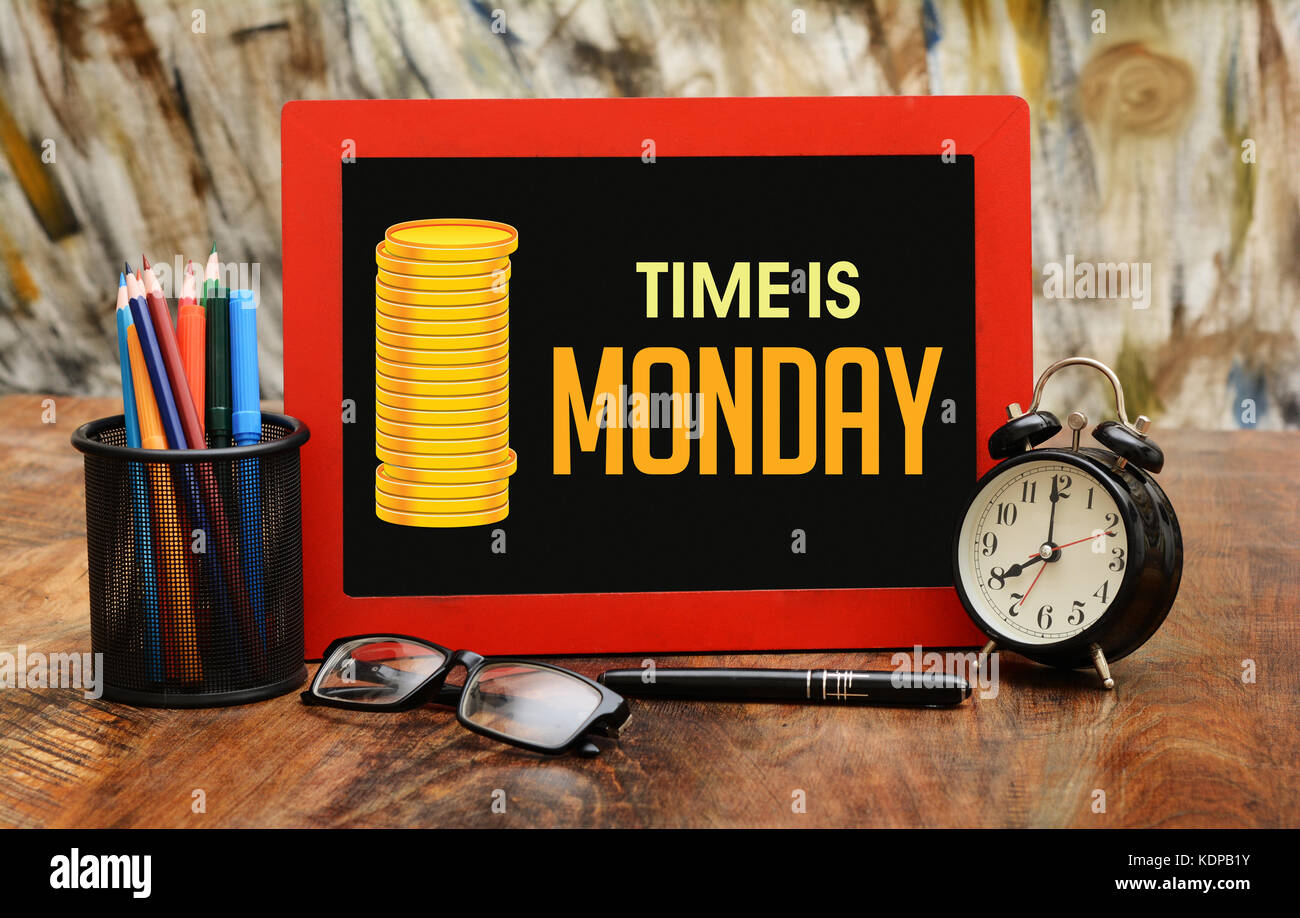 Time is Money concept with Gold Coins and table Clock Stock Photo - Alamy