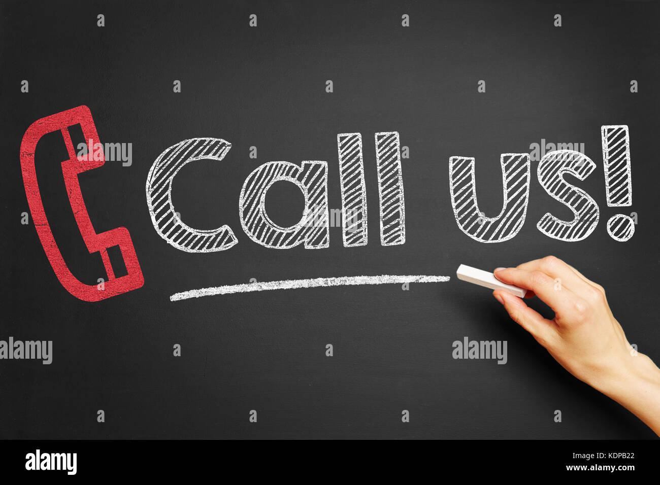 Hand writes "Call us" on blackboard as contact or communication service ...