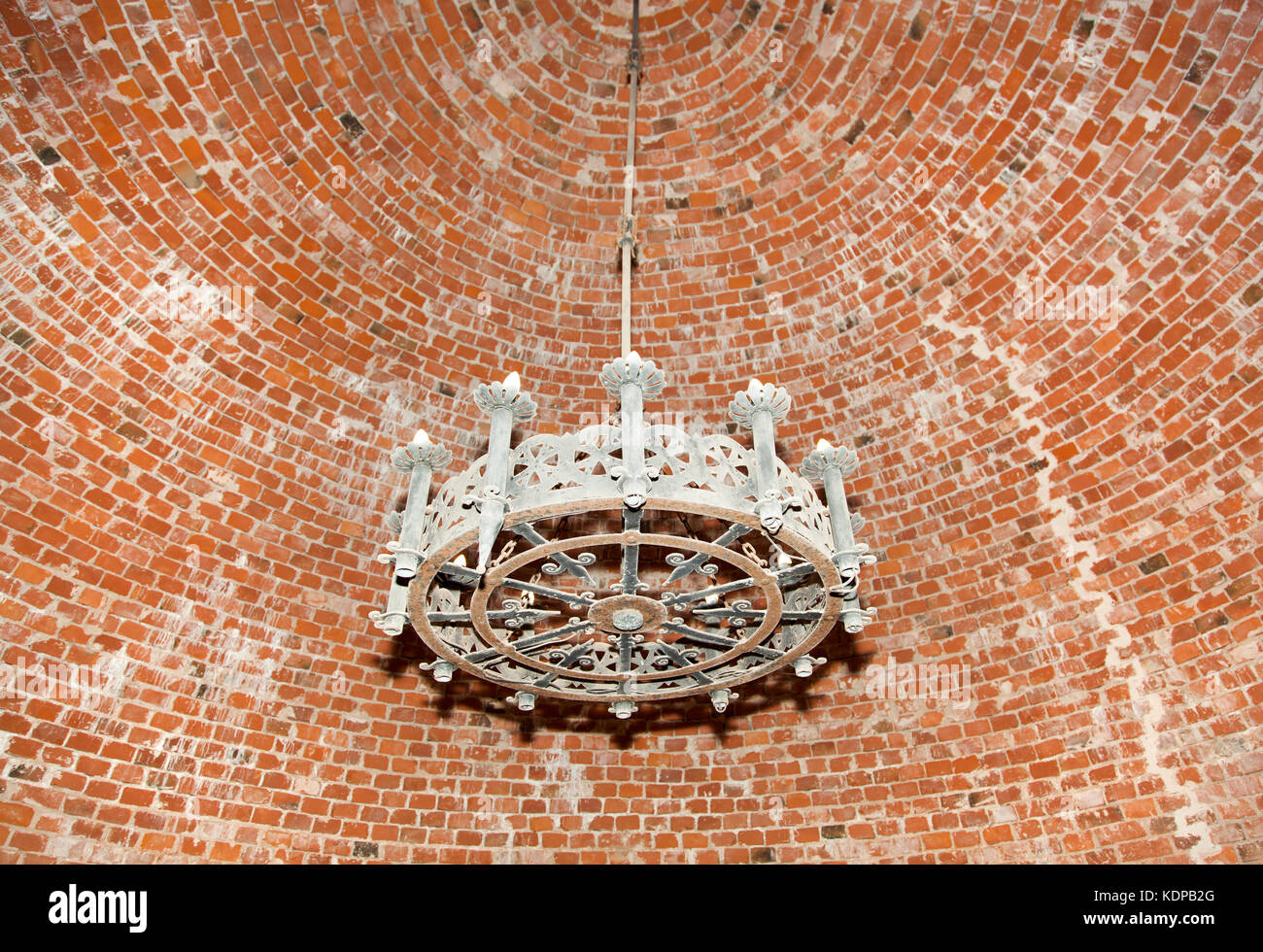 The dome shape brick ceiling with a brass chandelier in 14th century ...