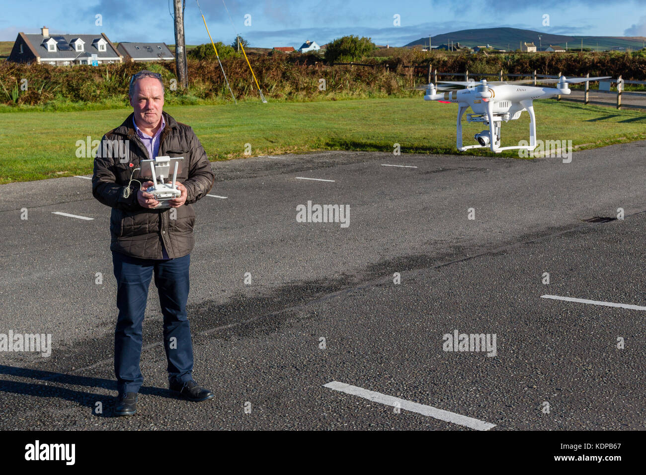 Middle age man, photographer flying a drone, County Kerry Ireland Stock ...
