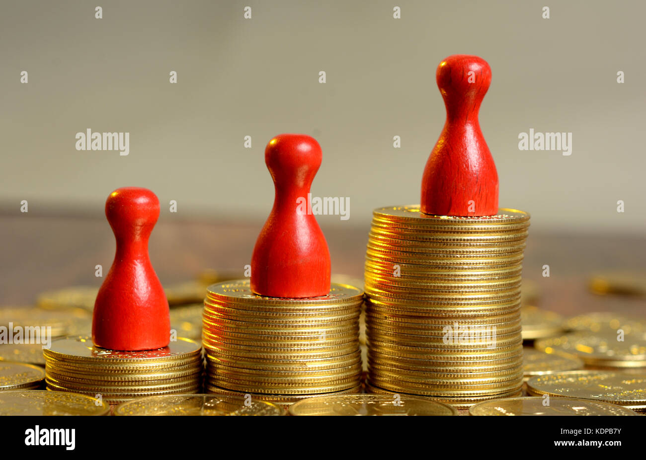 Stack of Golden Coins Graph going up with pawns Stock Photo - Alamy