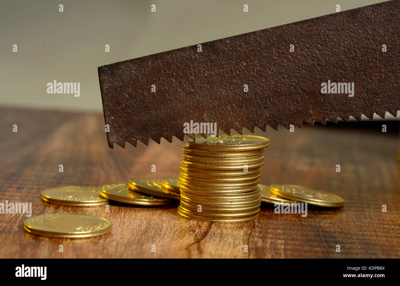 Cutting coins hi-res stock photography and images - Alamy