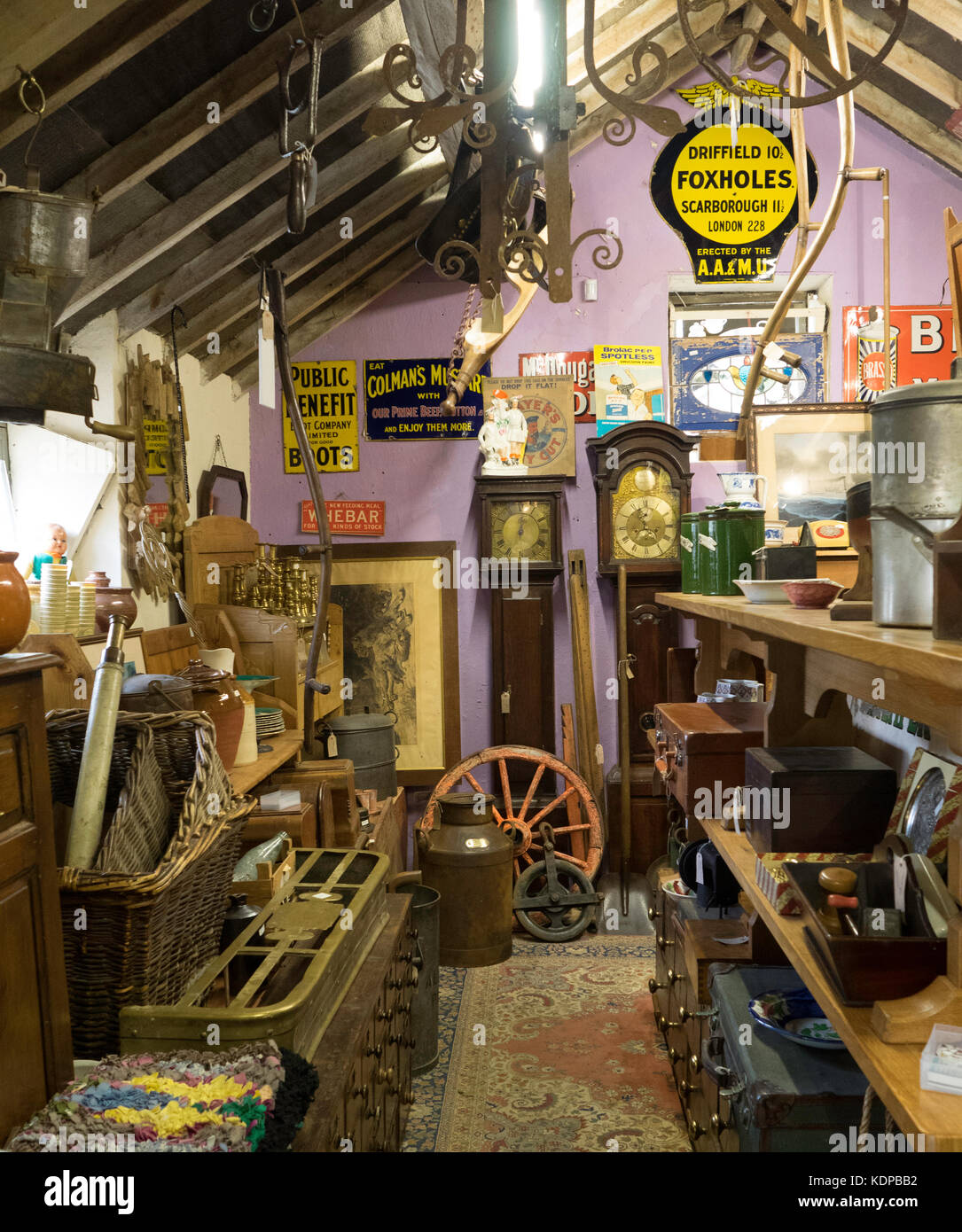 Interior of a rural antique shop with a collection of historic country ...