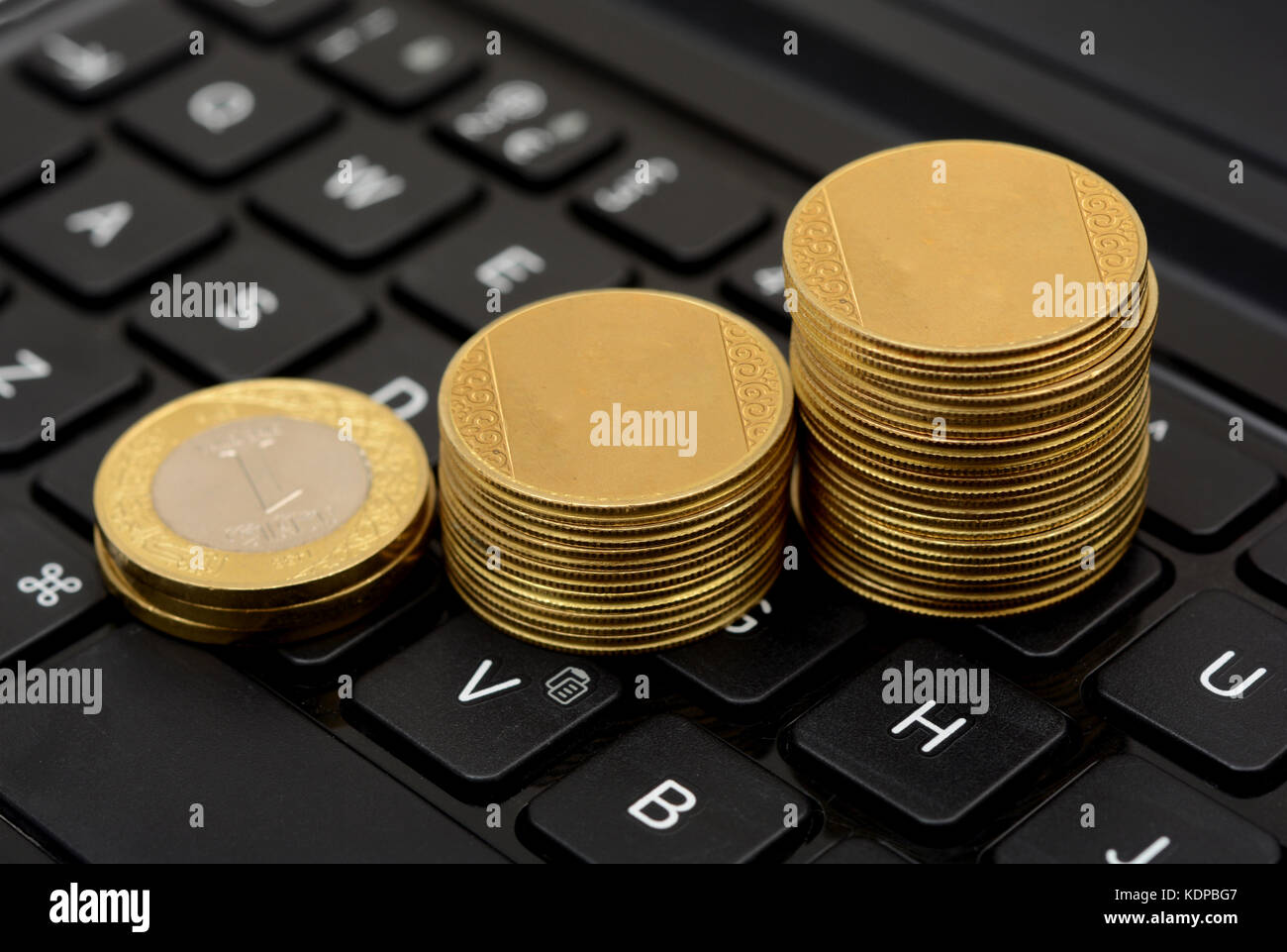 Golden Coins Graph going up on Keyboard online shopping concept Stock ...