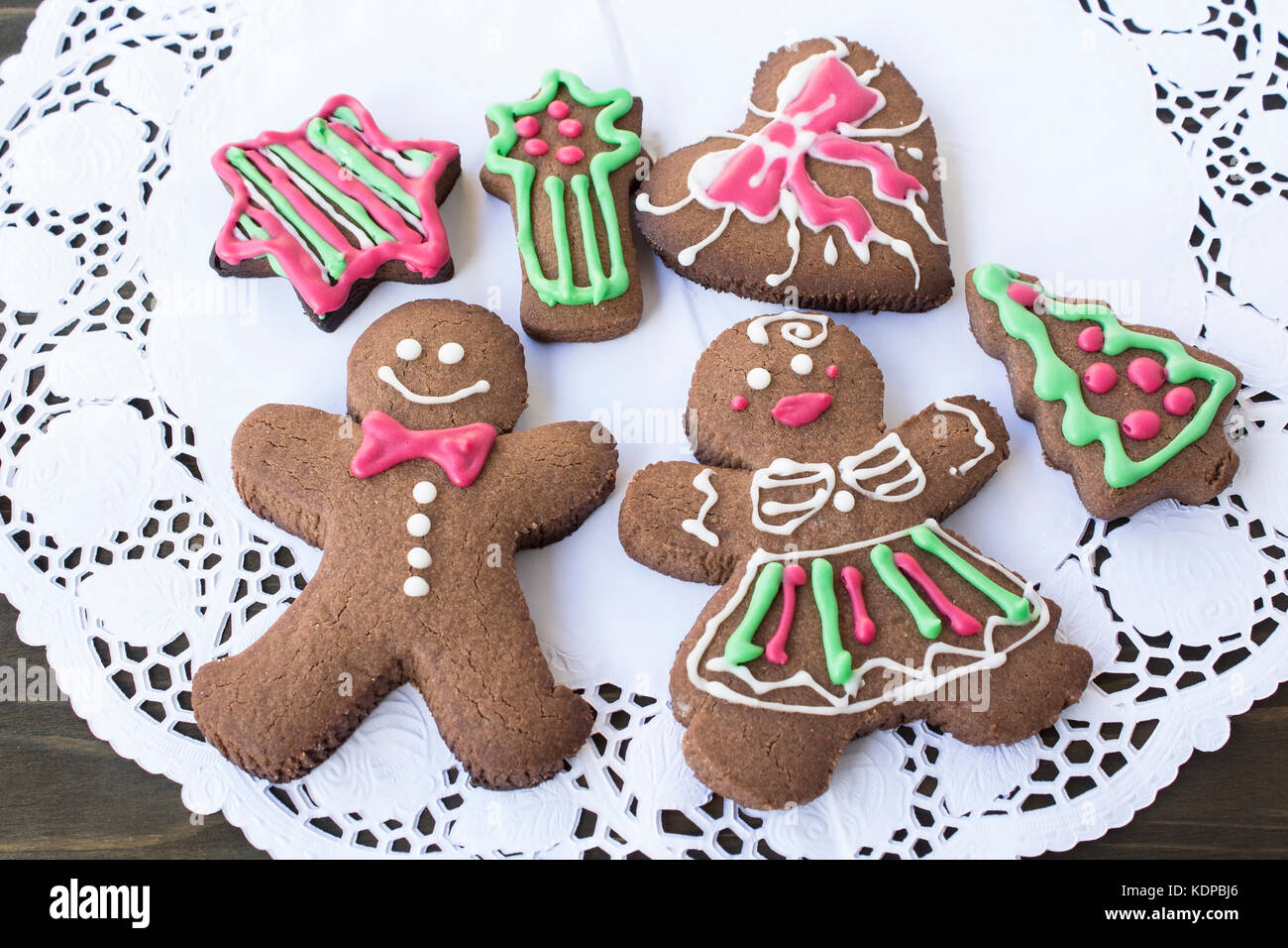 Gingerbread Couple Cookies on a Paper Lace Stock Photo - Alamy