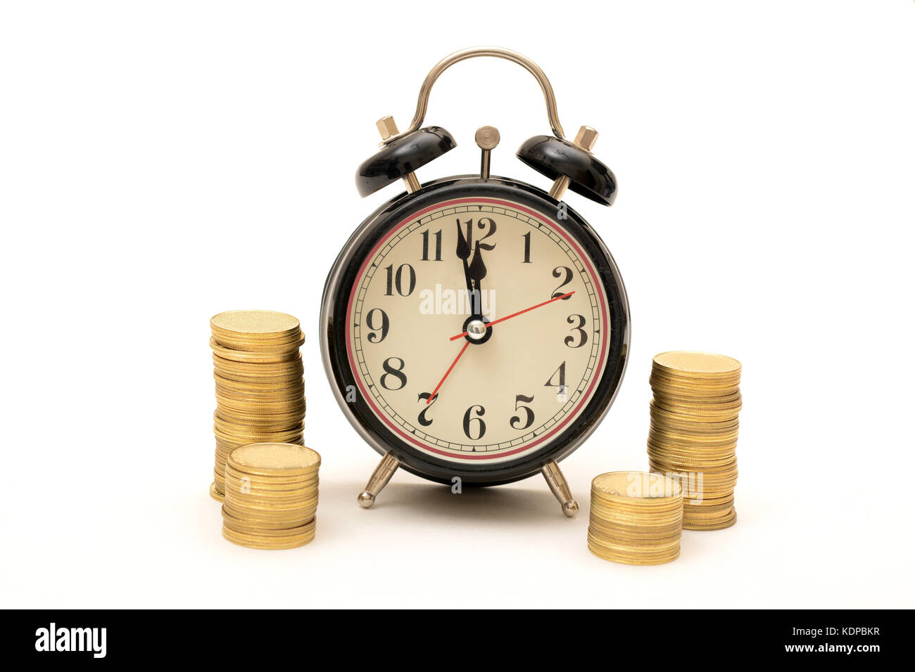 Time is Money concept with Coins stack around clock Stock Photo - Alamy