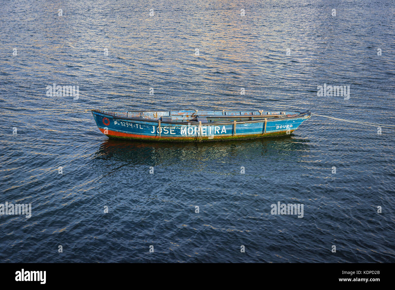 Old fishing dinghy on a Douro River seen from bank of Douro River in ...