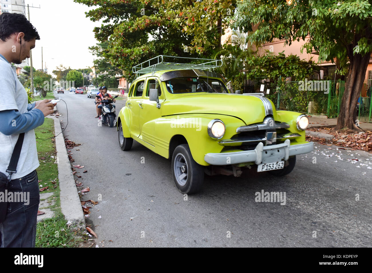 Young professional Cuban talking on mobile phone Havana Stock Photo - Alamy