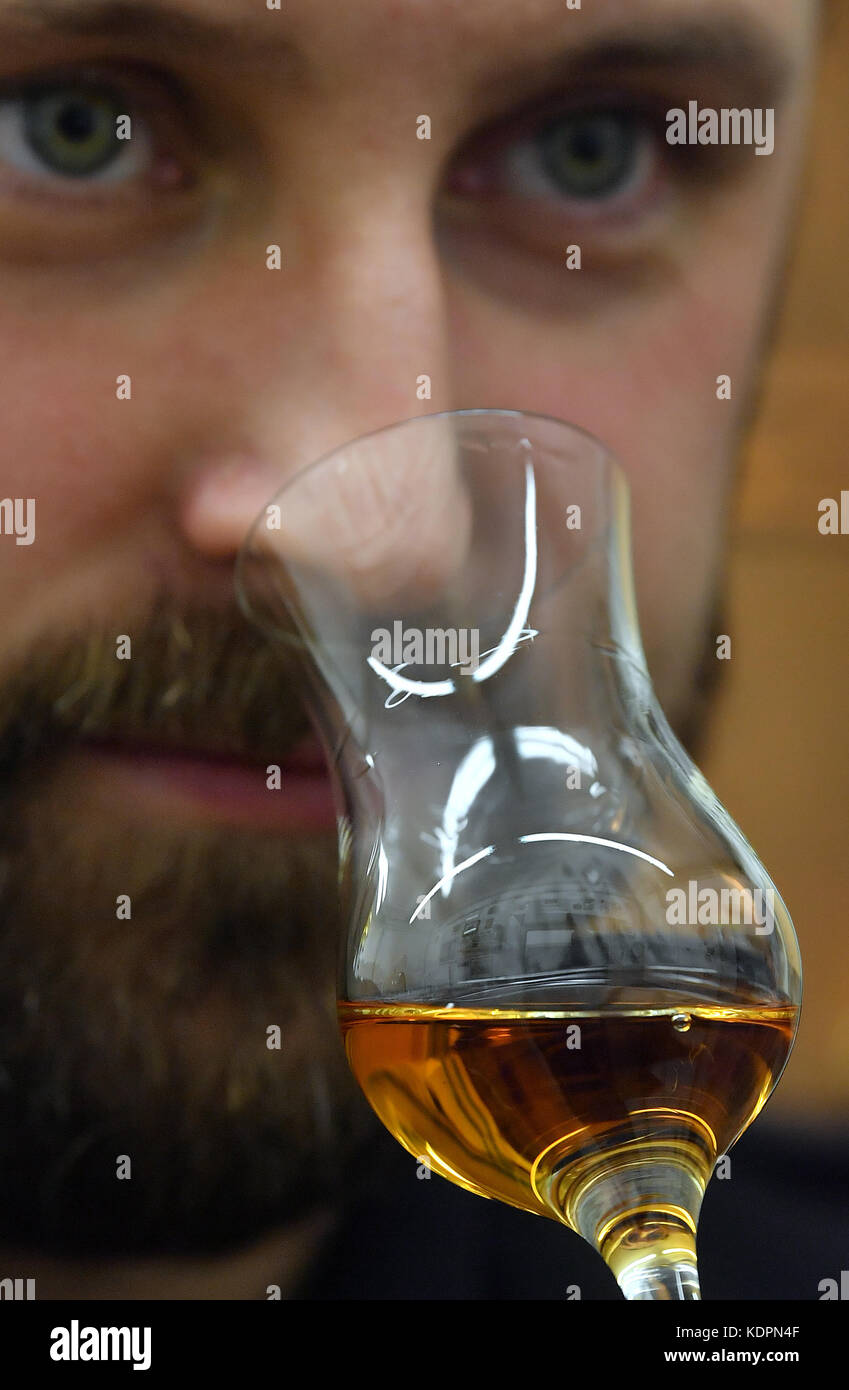 Zeitz, Germany. 10th Oct, 2017. Daniel Rost, master distiller, tasting ...
