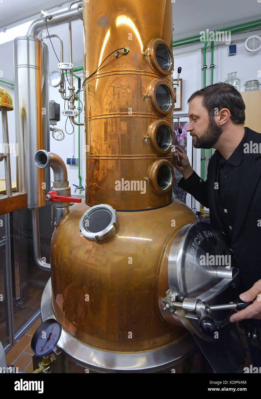 Zeitz, Germany. 10th Oct, 2017. Daniel Rost, master distiller, looking ...
