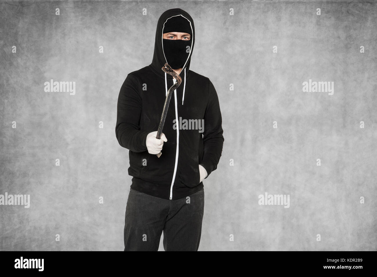 The thief threatens a crowbar Stock Photo - Alamy