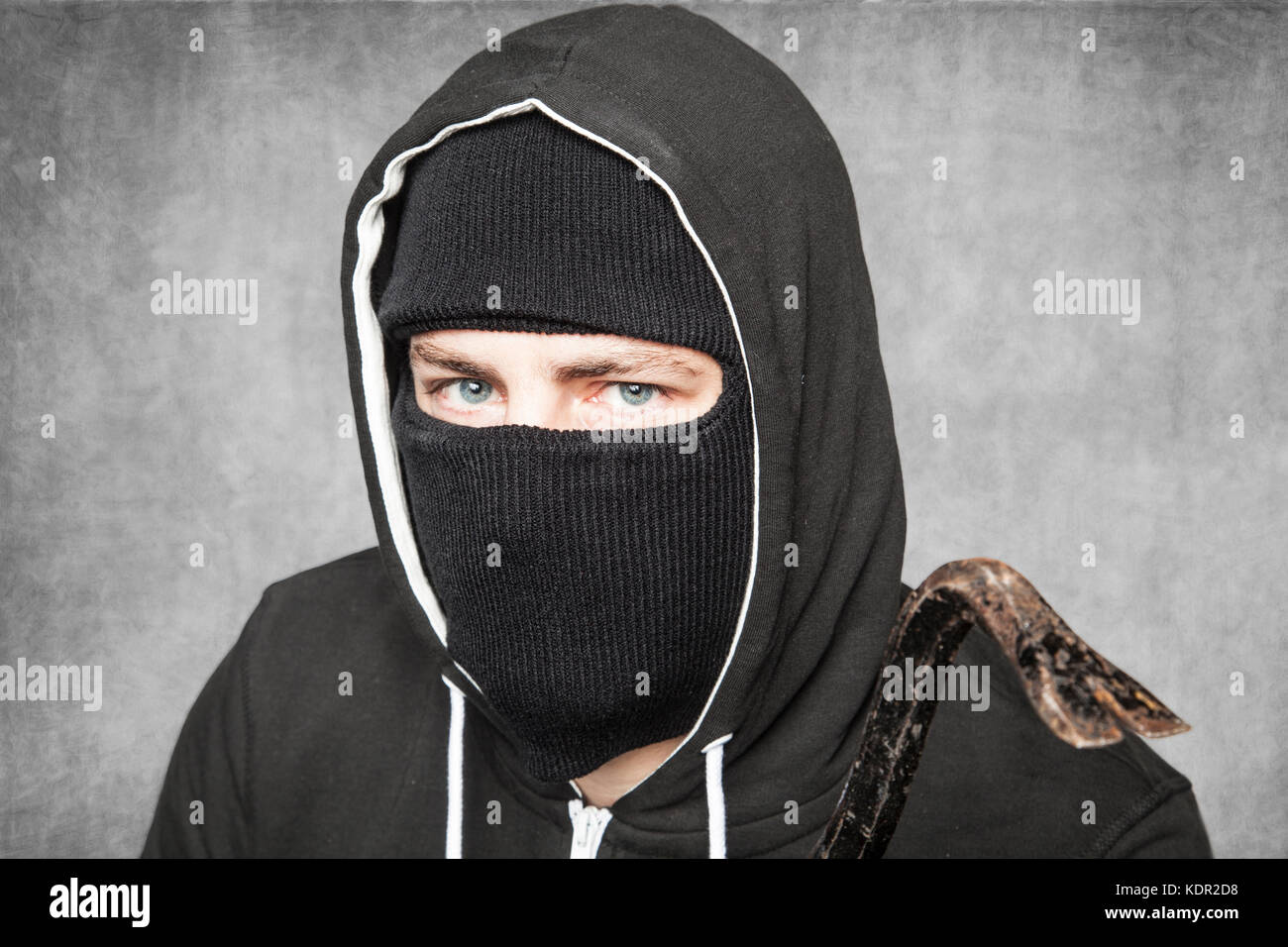 thief with a crowbar in his hand, close up Stock Photo - Alamy
