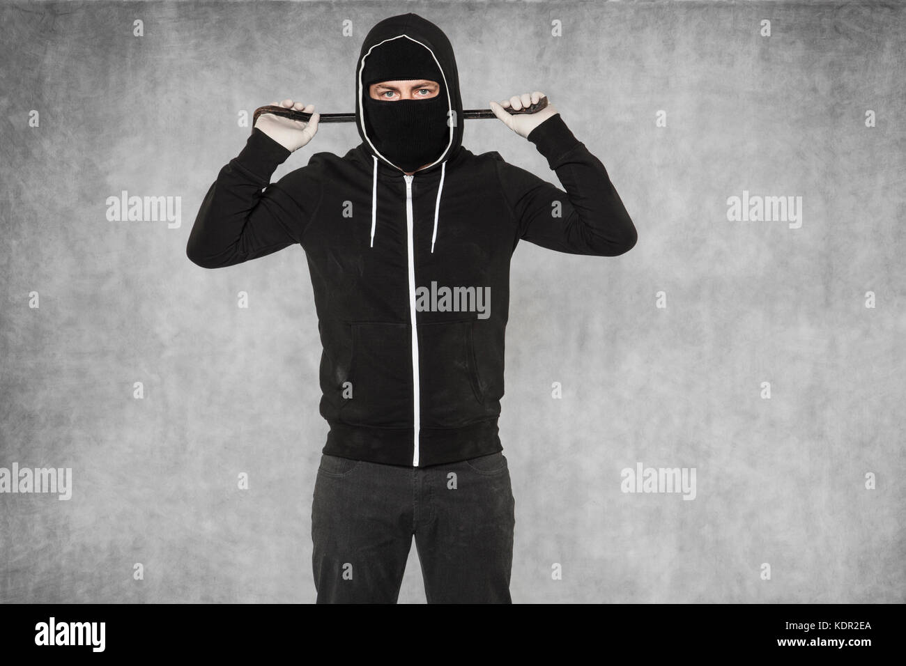 thief with a crowbar on his shoulders Stock Photo - Alamy