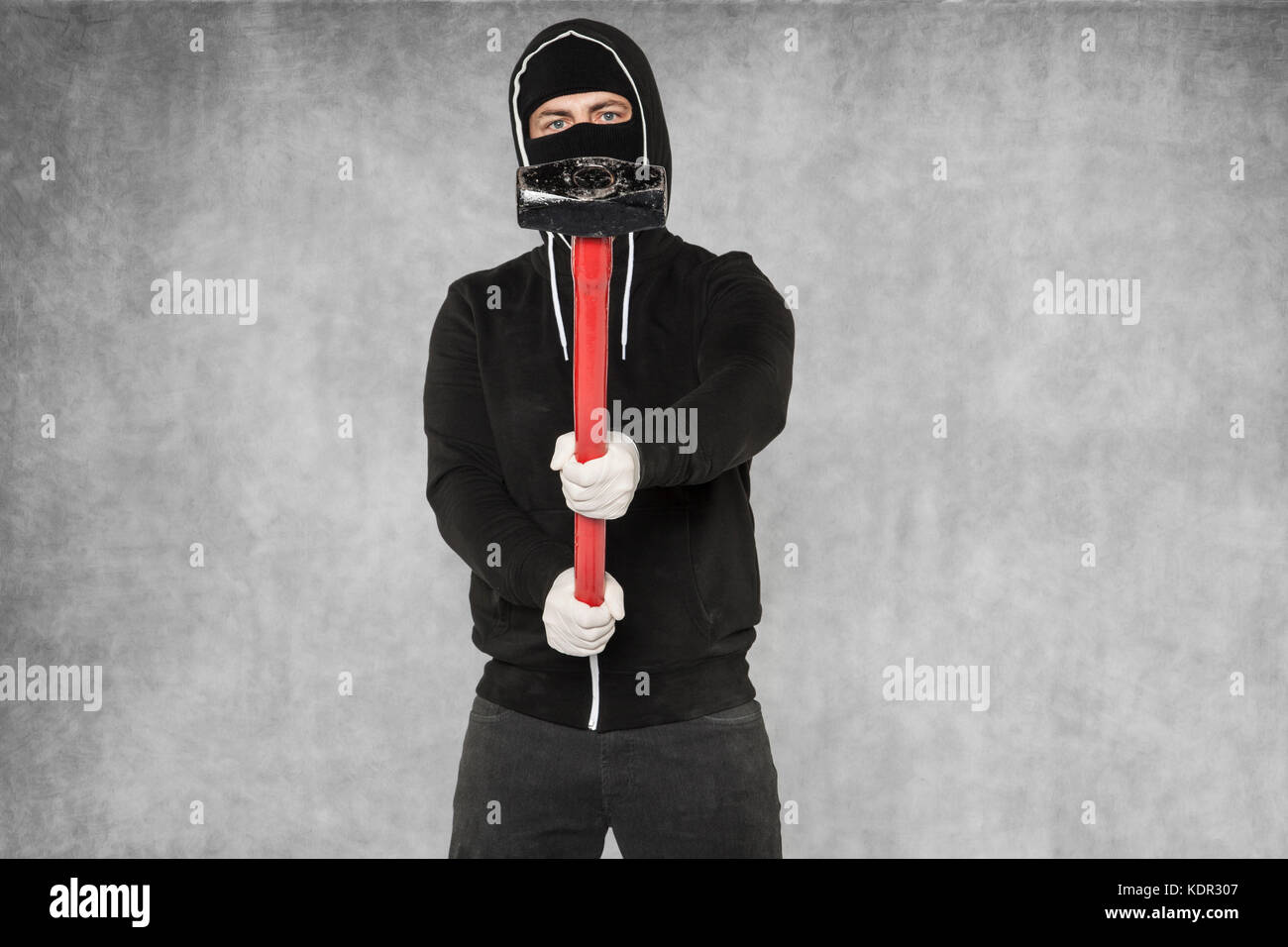 masked man with big hammer Stock Photo - Alamy