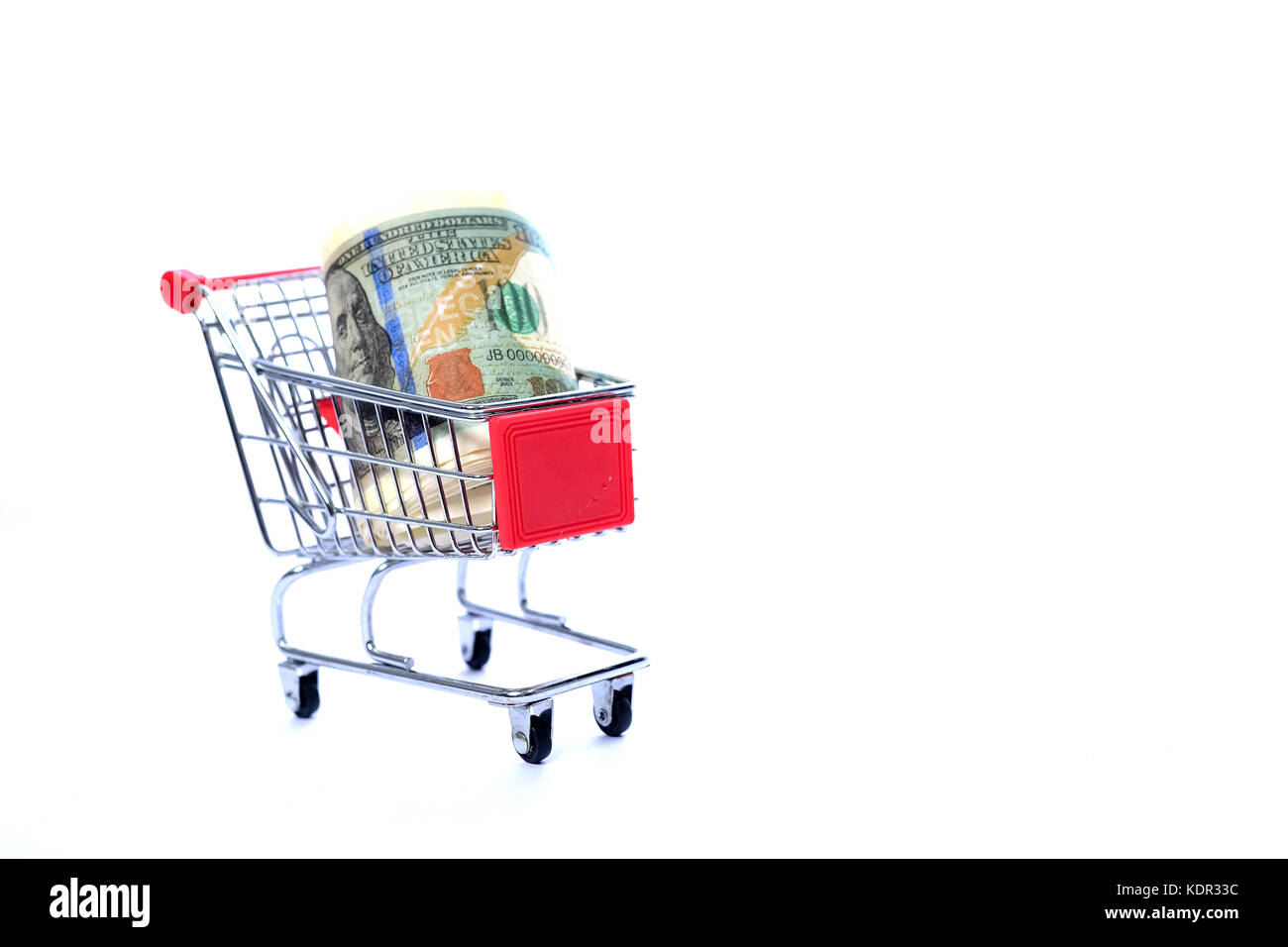 Dollar in shopping cart Stock Photo - Alamy
