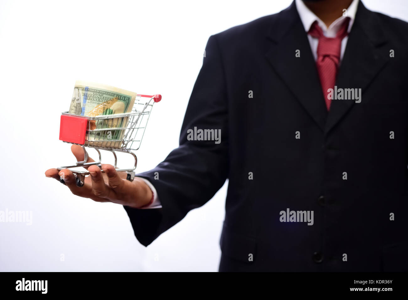Businessman offering dollar on white background Stock Photo - Alamy