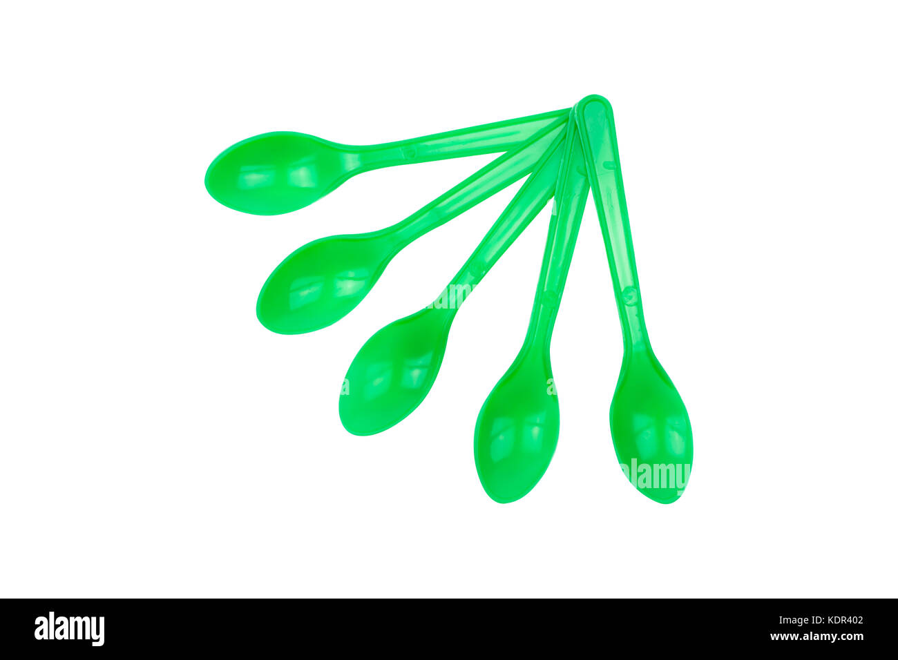 Green plastic spoon isolated on white background Stock Photo - Alamy