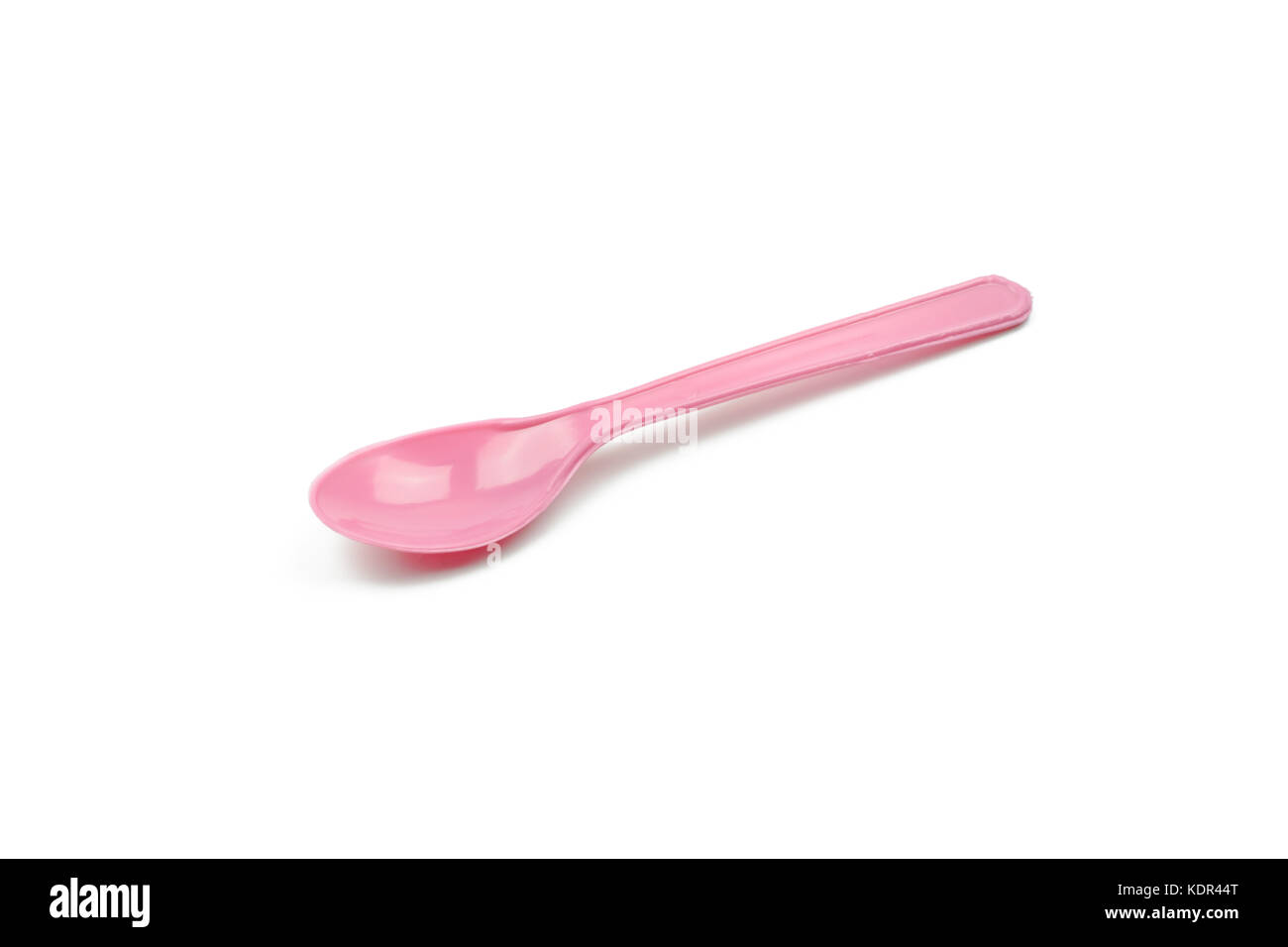 Pink plastic spoon isolated on white background Stock Photo - Alamy
