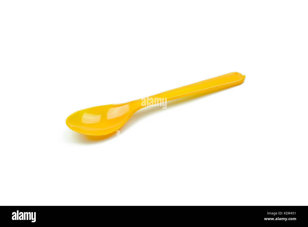 Orange plastic spoon isolated on white background Stock Photo - Alamy