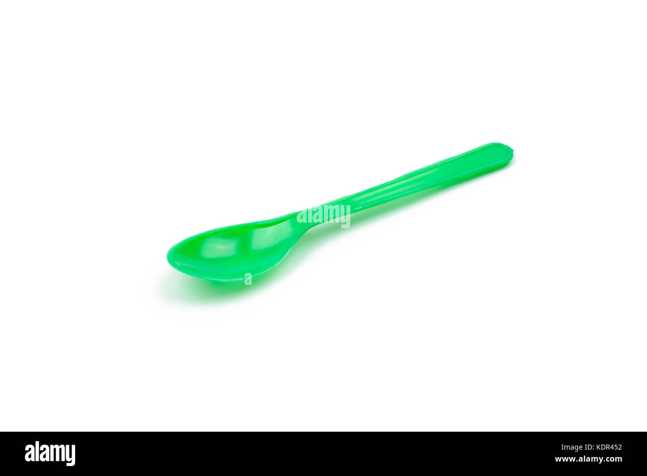 Green plastic spoon isolated on white background Stock Photo - Alamy