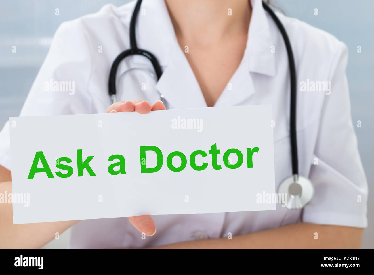 Close-up Of Doctor Holding White Card Showing Ask Your Doctor Sign ...