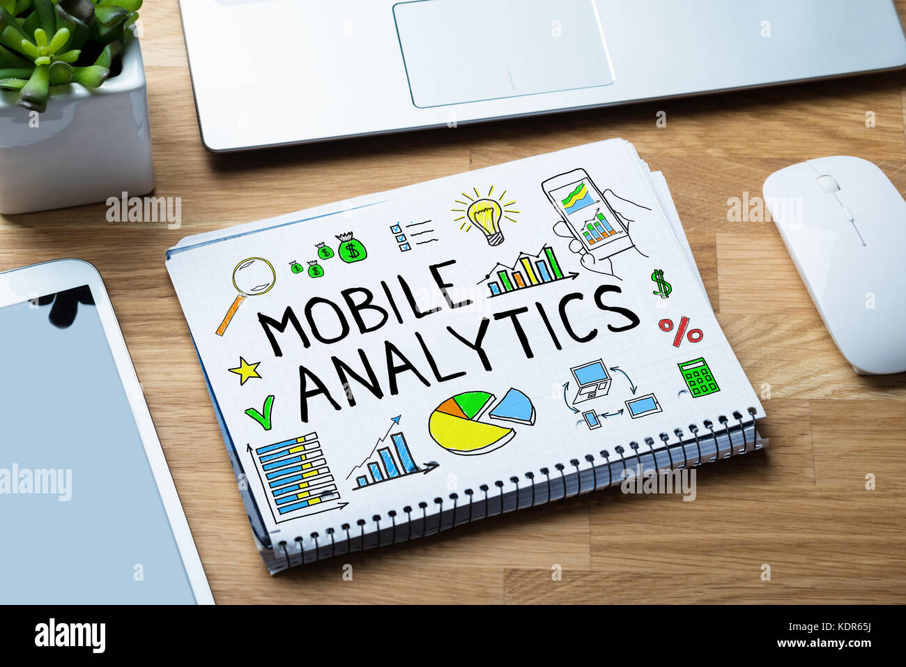 High Angle View Of Mobile Analytic Concept On Binder At Wooden Desk In ...