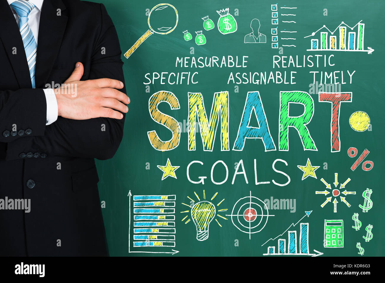 Close-up Of Successful Businessperson Standing Near Blackboard Showing ...