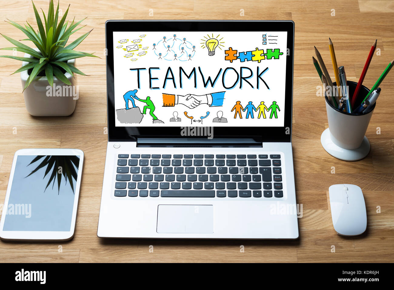 Close-up Of Laptop Showing Teamwork Concept With Mobilephone On Wooden ...