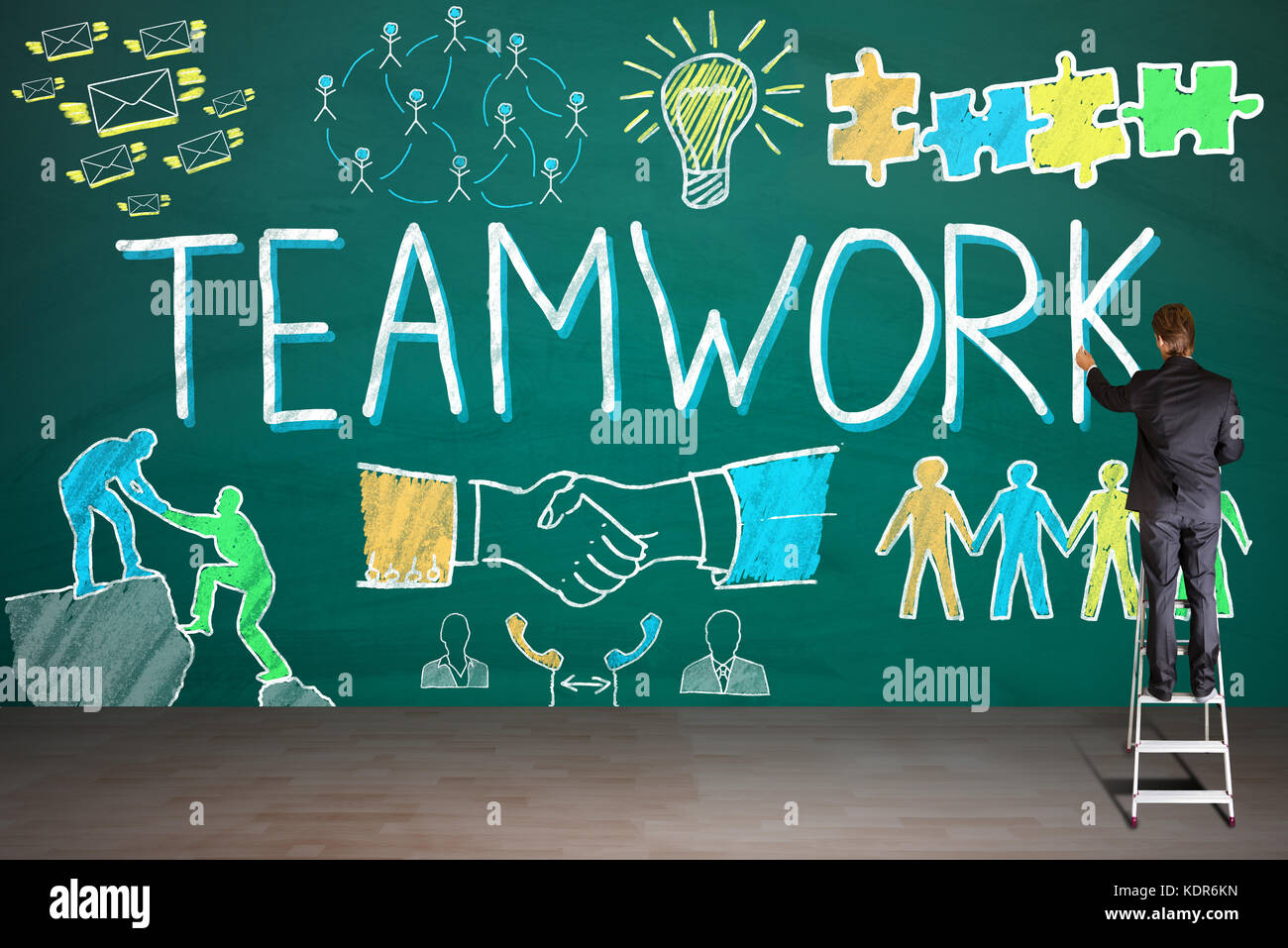 Rear View Of Businessperson Standing On Staircase Drawing Teamwork ...
