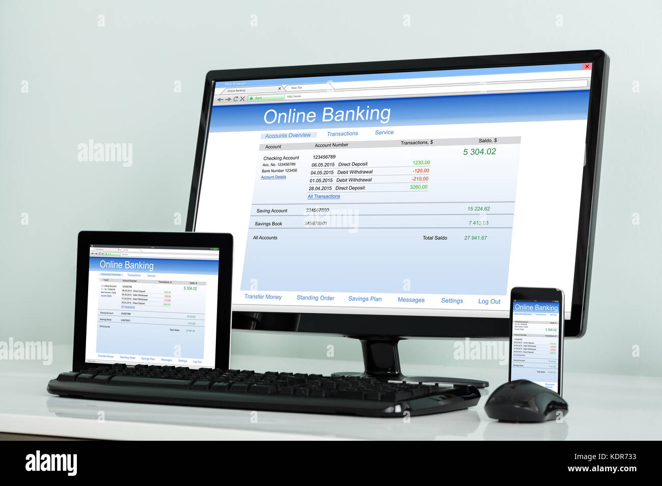 Close-up Of Different Electronic Gadget Showing Online Banking System ...