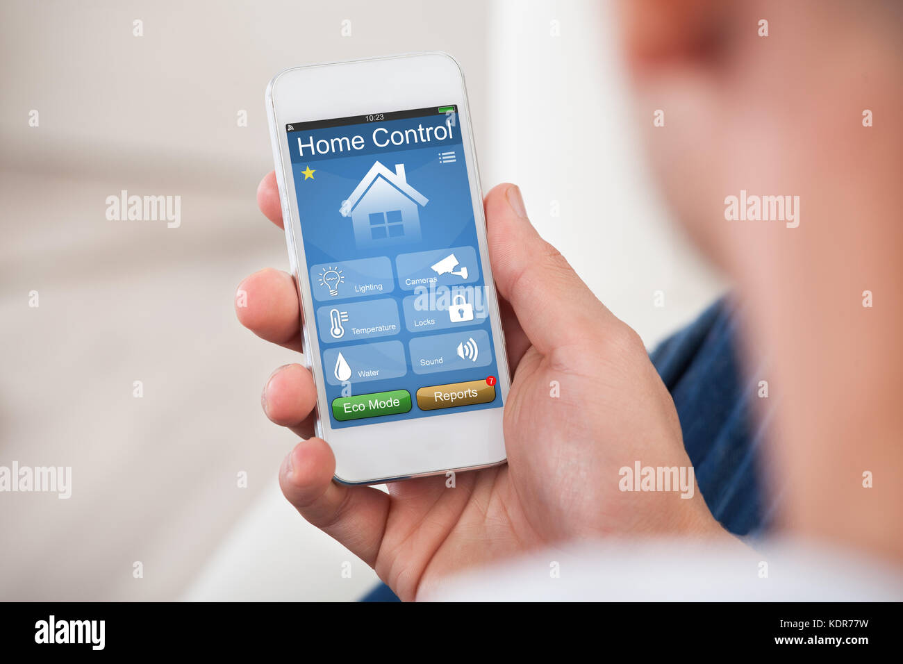 Close-up Of Person Hand Using Home Control System On Mobilephone Stock ...