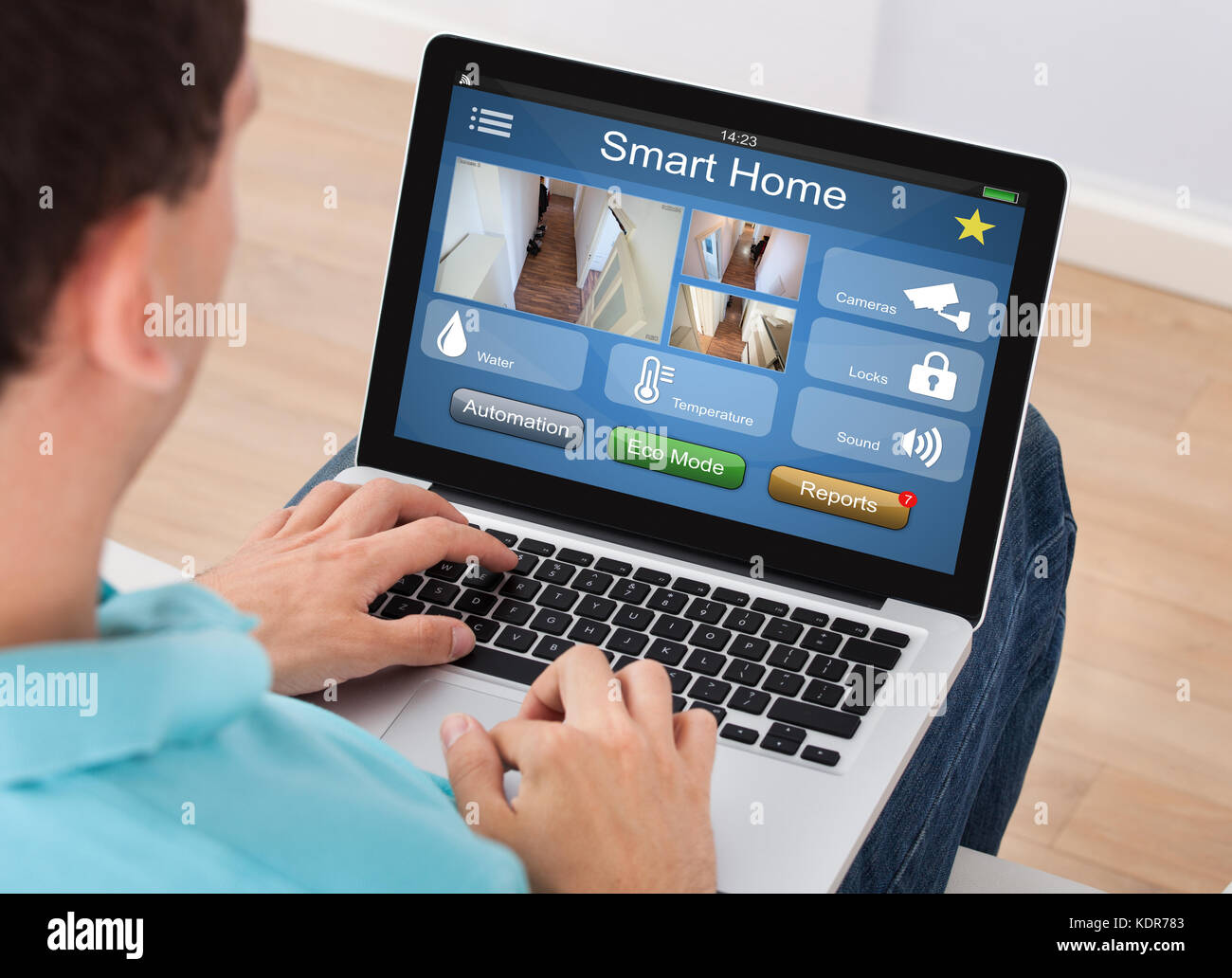 Close-up Of Man Using Smart Home System On Mobilephone At White Desk ...