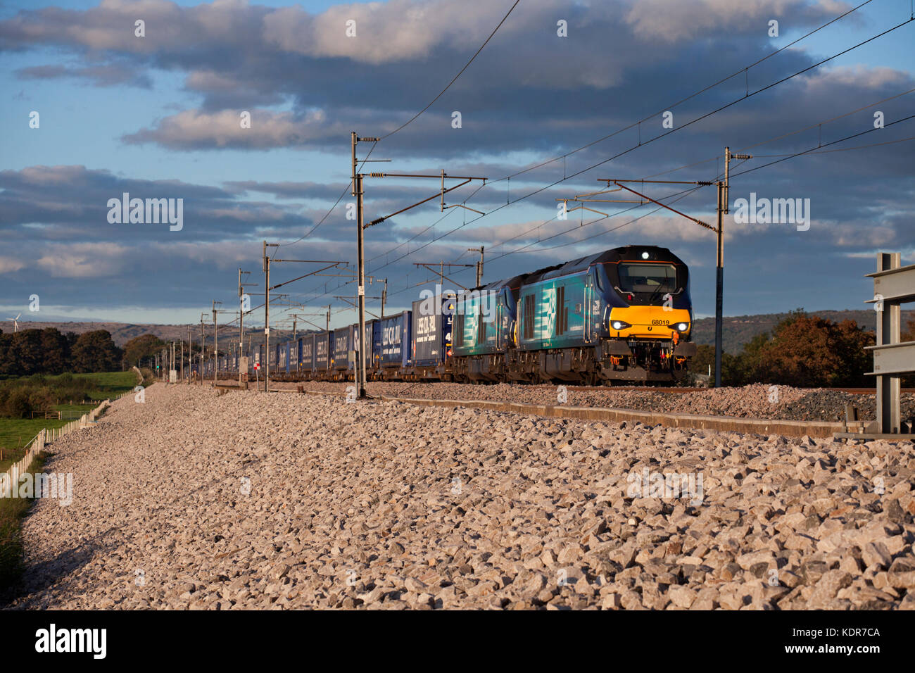 2 Direct rail Services class 68 locomotives pass Carnforth with a ...