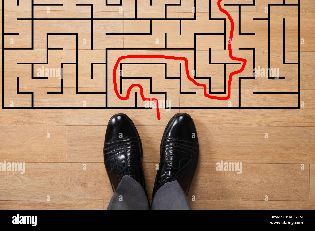 High Angle View Of Businessman Standing In Front Of Labyrinth Stock ...
