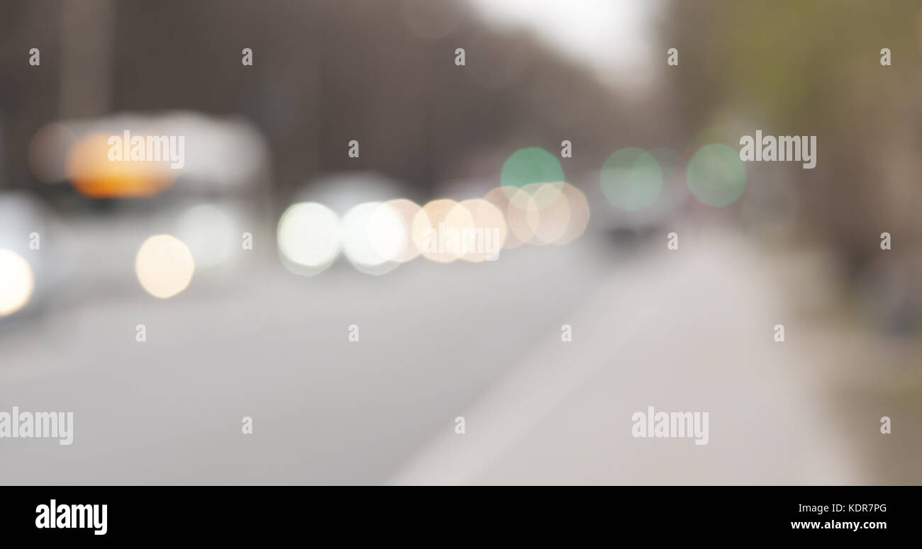 blurred background of traffic in town at daytime Stock Photo - Alamy