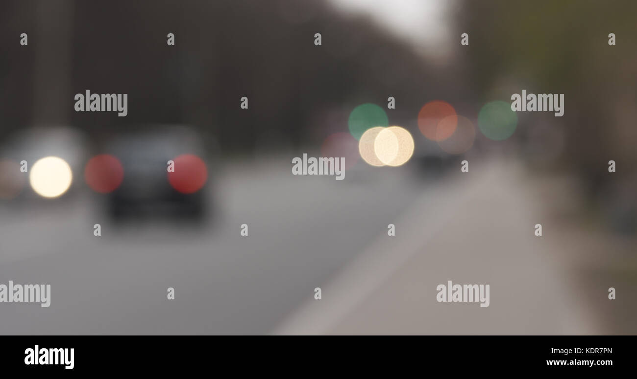 blurred background of traffic in town at daytime Stock Photo - Alamy