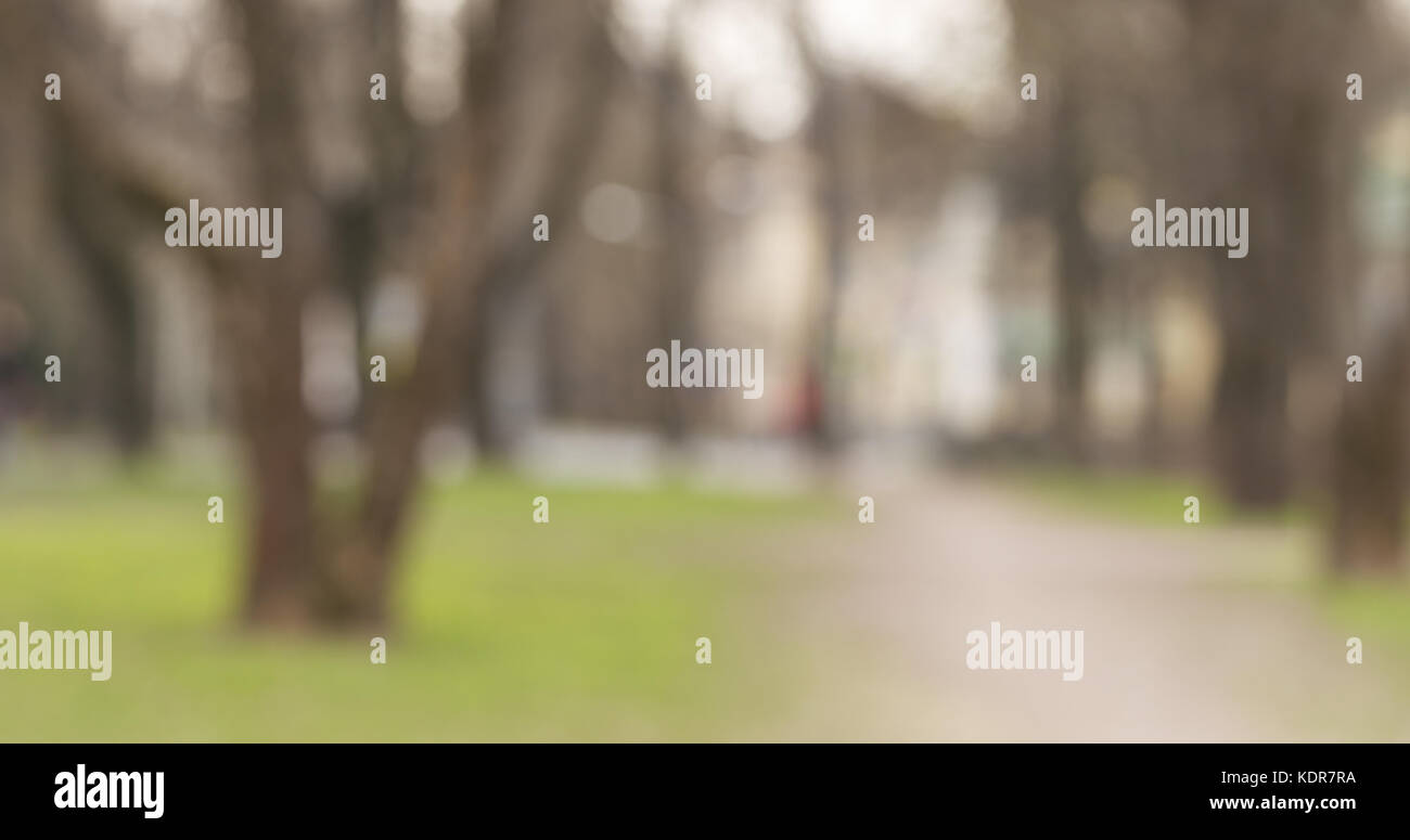 blurred background of traffic in green town at daytime Stock Photo - Alamy