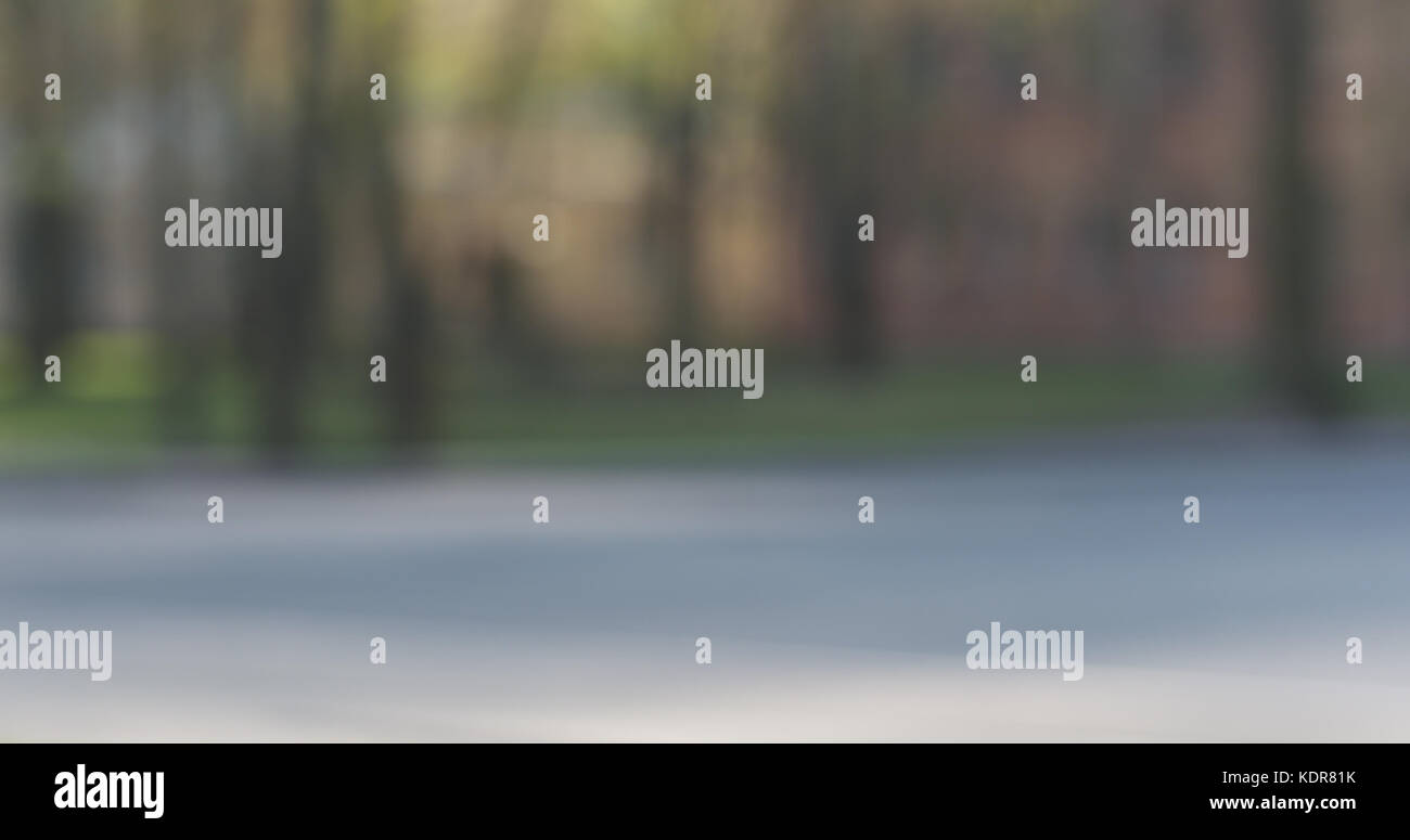 blurred background of traffic in town at daytime Stock Photo - Alamy