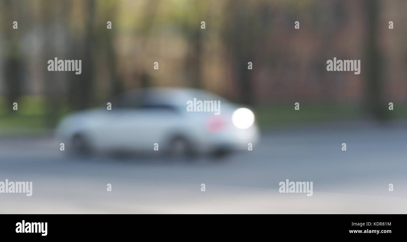 blurred background of traffic in town at daytime Stock Photo - Alamy