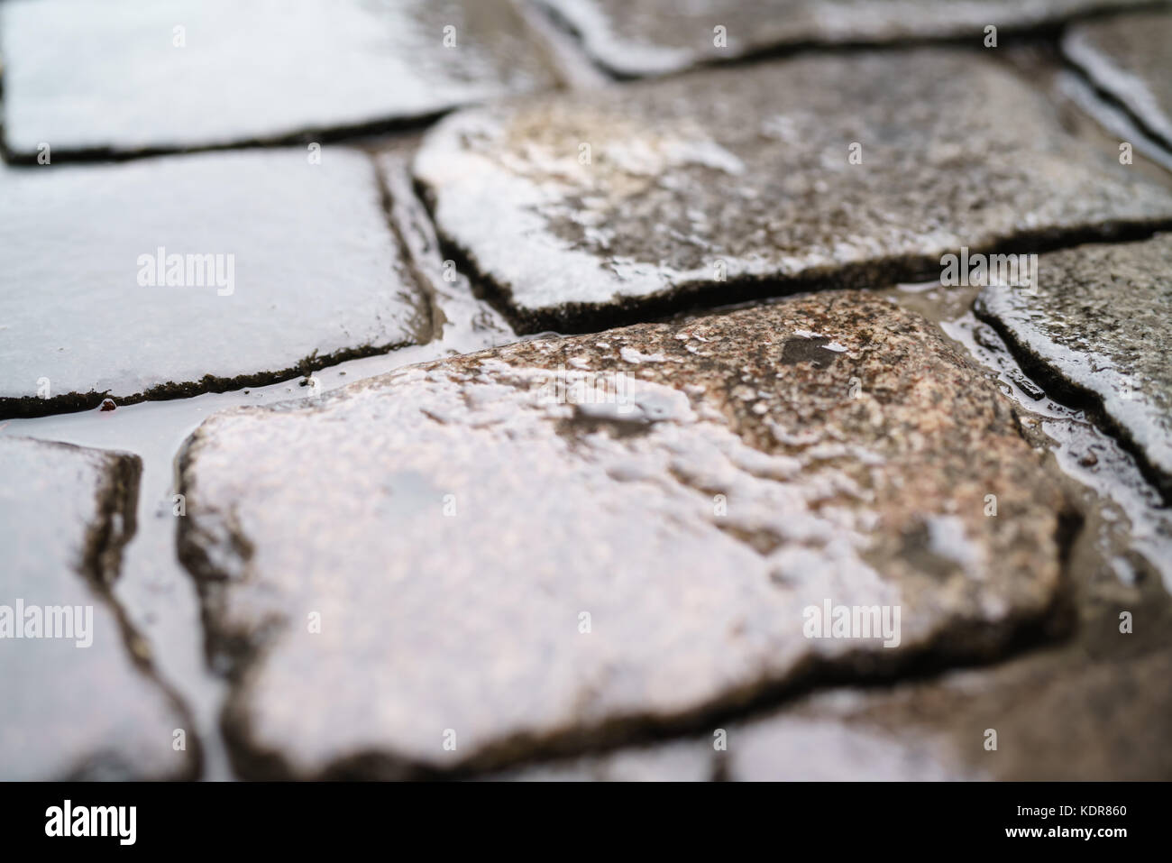 wet old granite pavement closeup Stock Photo - Alamy