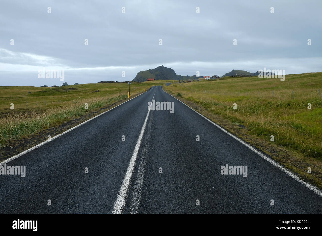 Remote single line country road through Vestmannaeyjar on Heimaey ...