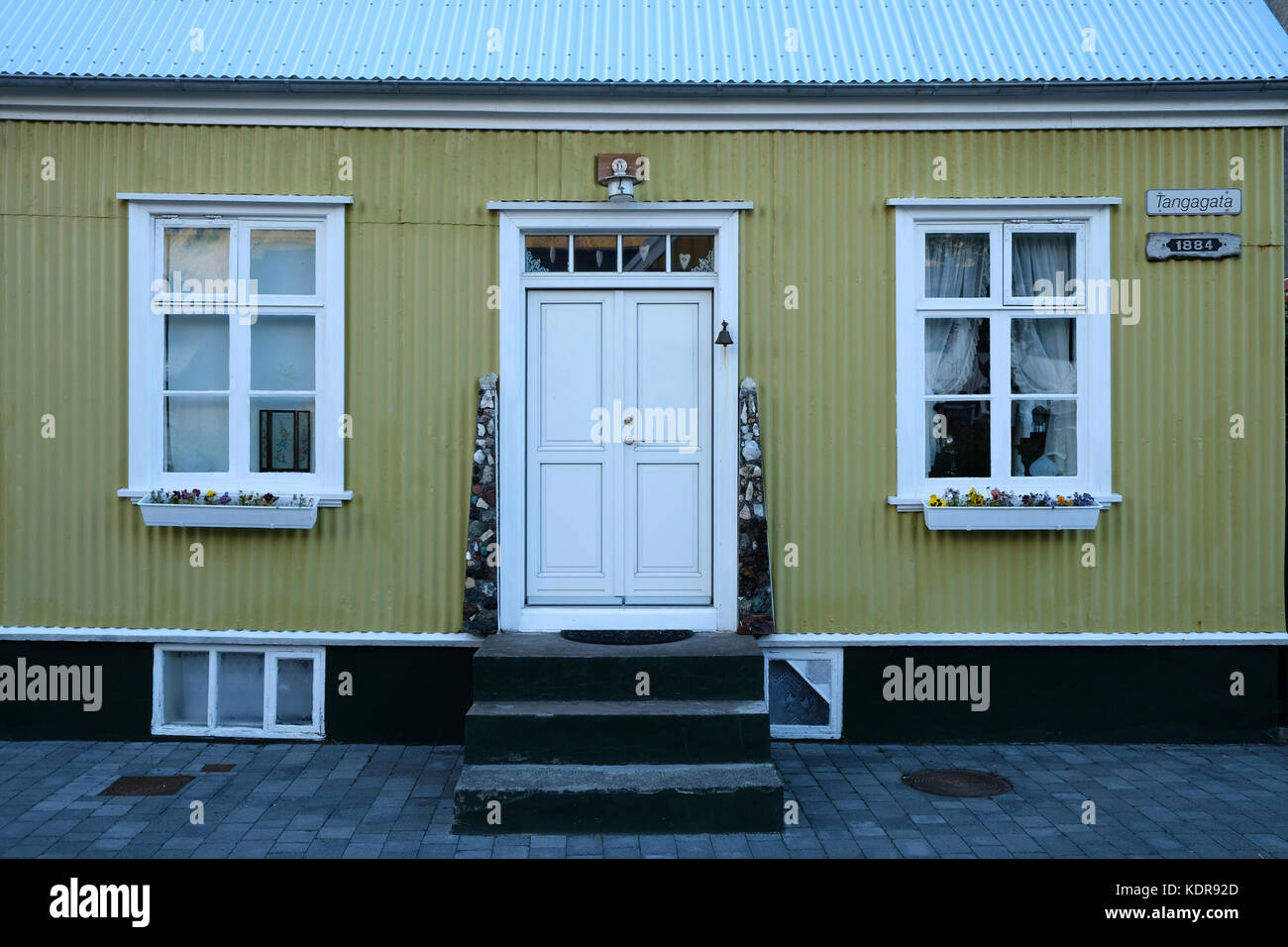 Traditional Icelandic wooden yellow house front in remote Westfjords ...